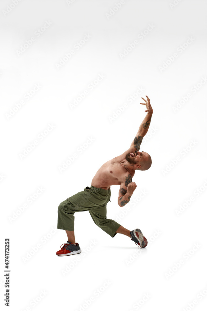 Angry man posing with fist and sticking out tongue Stock Photo | Adobe ...