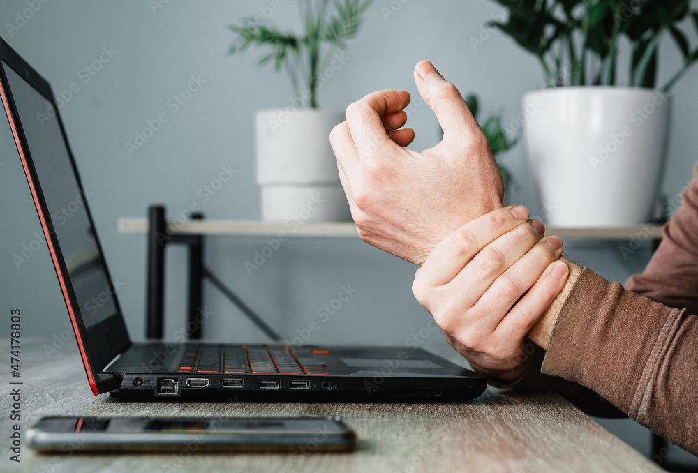 A man suffering from numbness in his hand and wrist, arthritis and ...