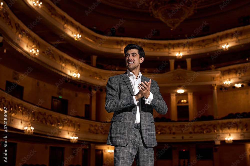 Young male entertainer, presenter or actor on stage. male public ...