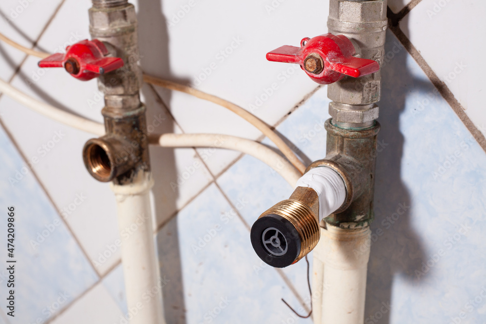 New plumbing fitting installation to old rusty pipes on water pipeline ...