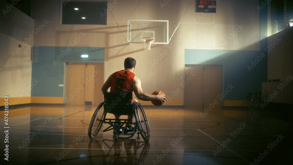 Wheelchair Basketball Player Dribbling Ball, Shooting it Successfully ...