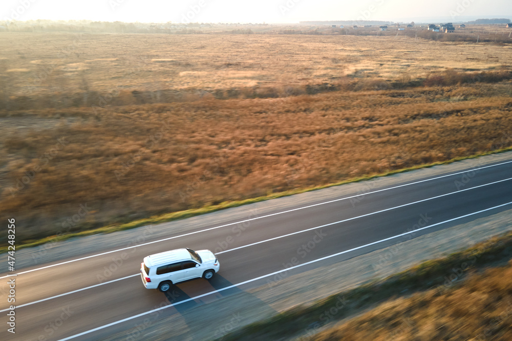 Aerial view of intercity road with blurred fast driving environment ...