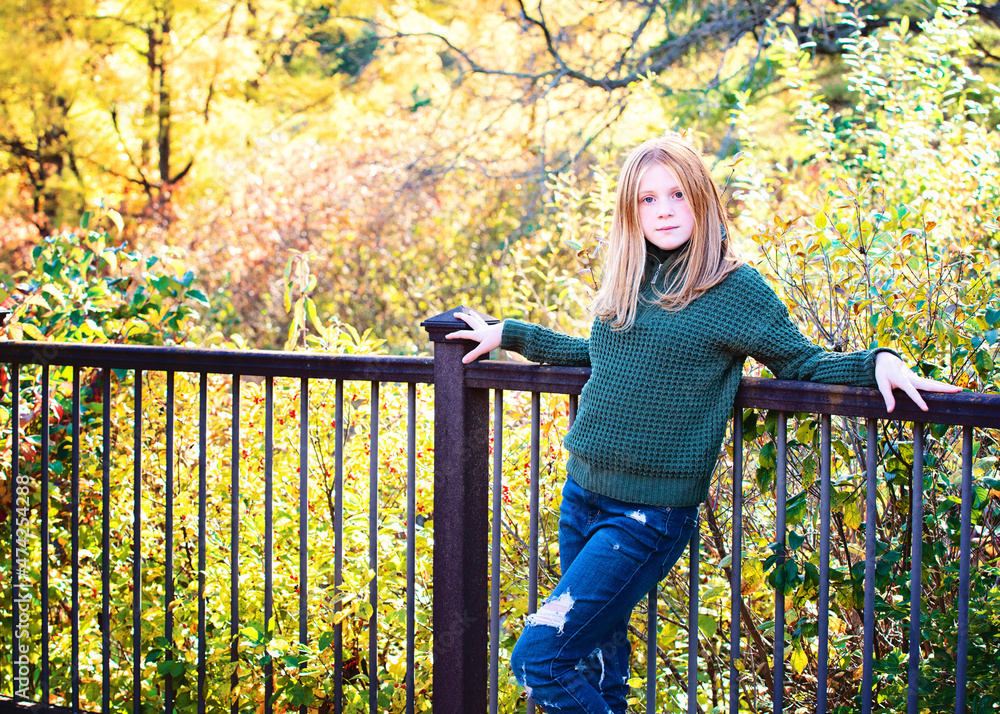 Pretty tween girl with red hair outdoors in fall colors. Stock Photo ...