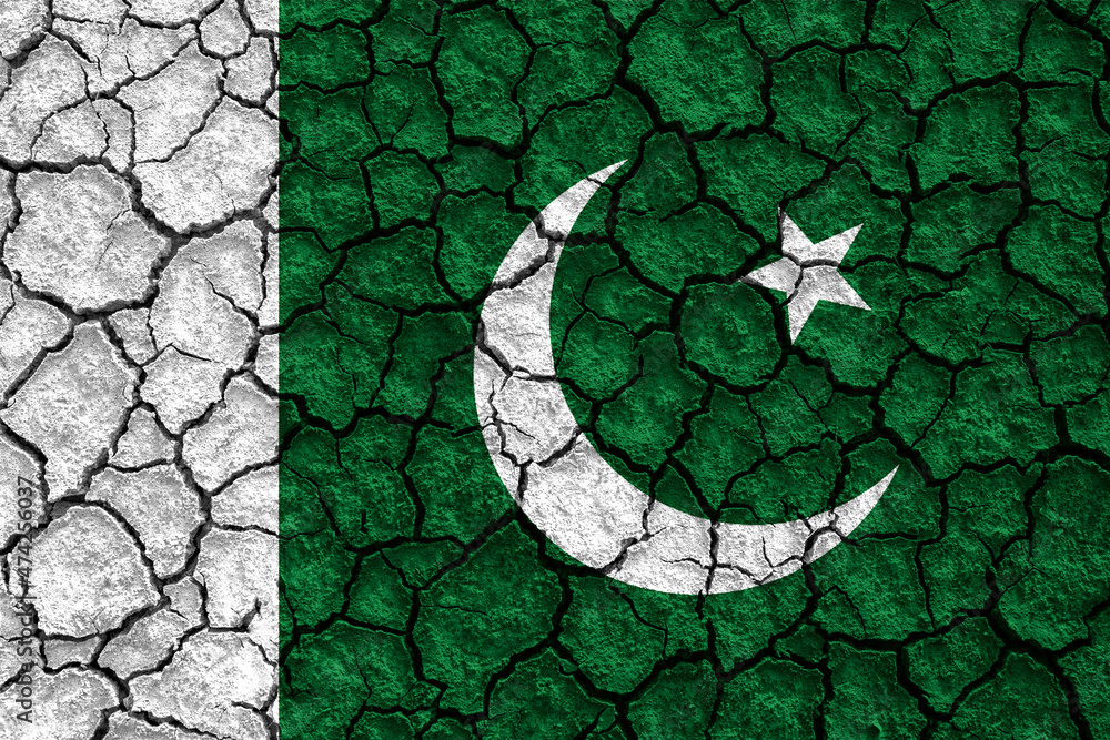 Islamic Republic of Pakistan flag on dry earth ground texture ...