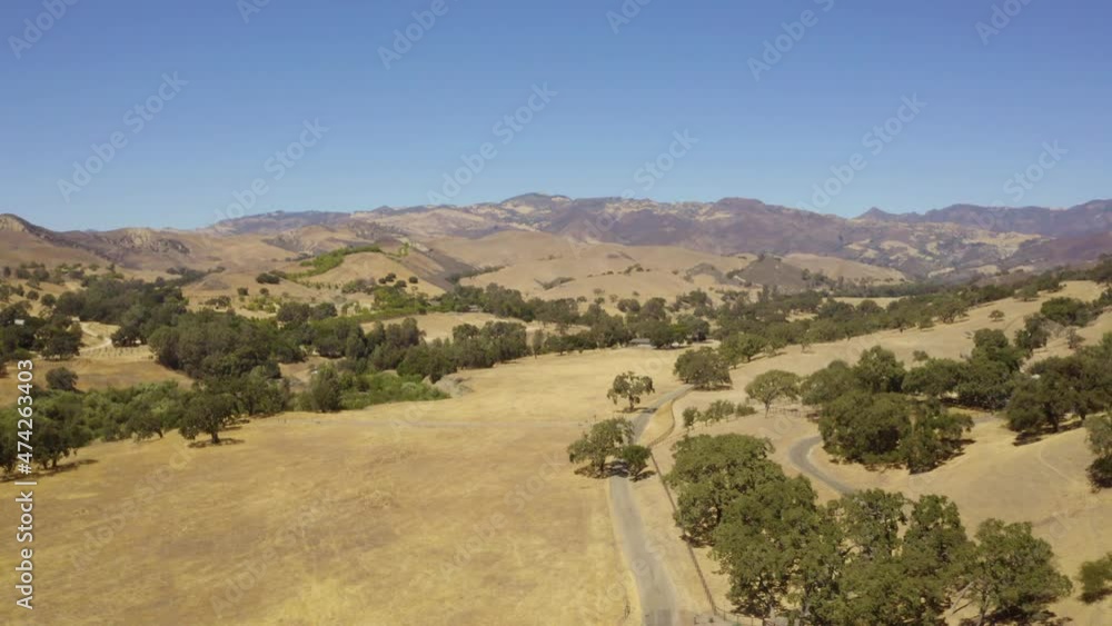 Beautiful outdoor ranch landscape, vast golden mountain tops with long ...