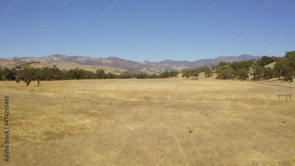 Beautiful outdoor ranch landscape, vast golden mountain tops with long ...