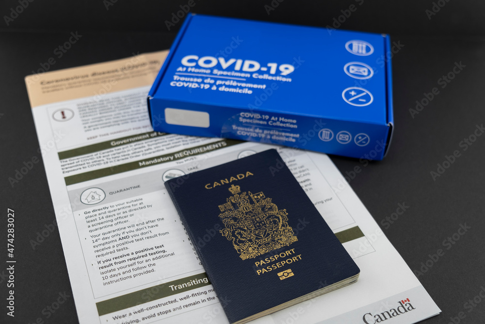 Canadian passport in the foreground and Covid 19 at home specimen ...