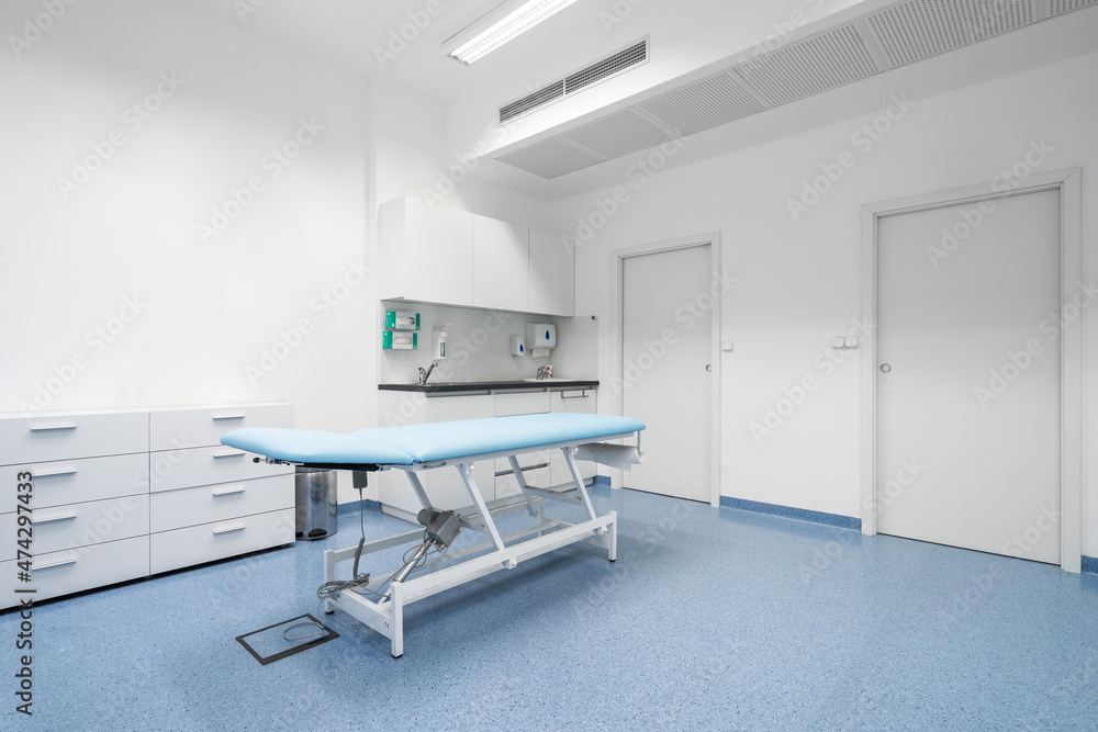 Clean and comfortable room in the hospital with examination table ...