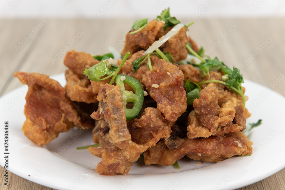 Tall pile of crispy deep fried salt and pepper ribs for some spicy and ...