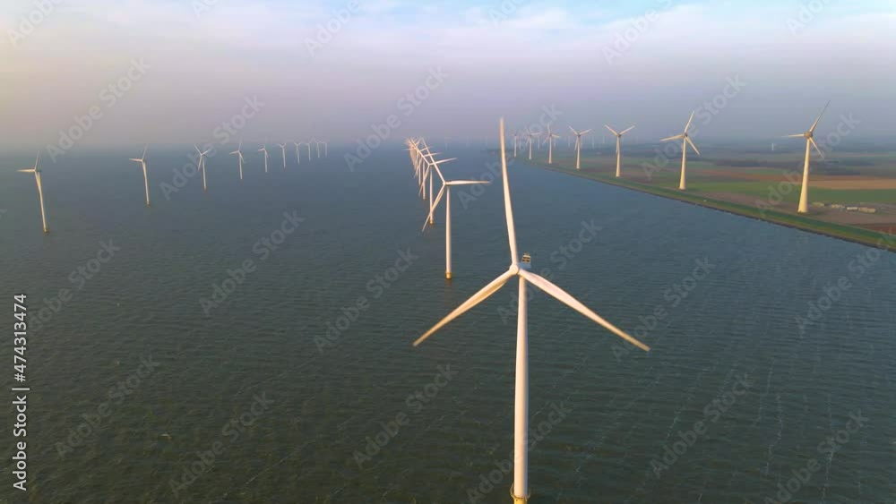 Wind turbines in the early morning, windmill park in the Netherlands ...