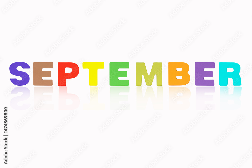 SEPTEMBER month English made of wood isolated on white background ...