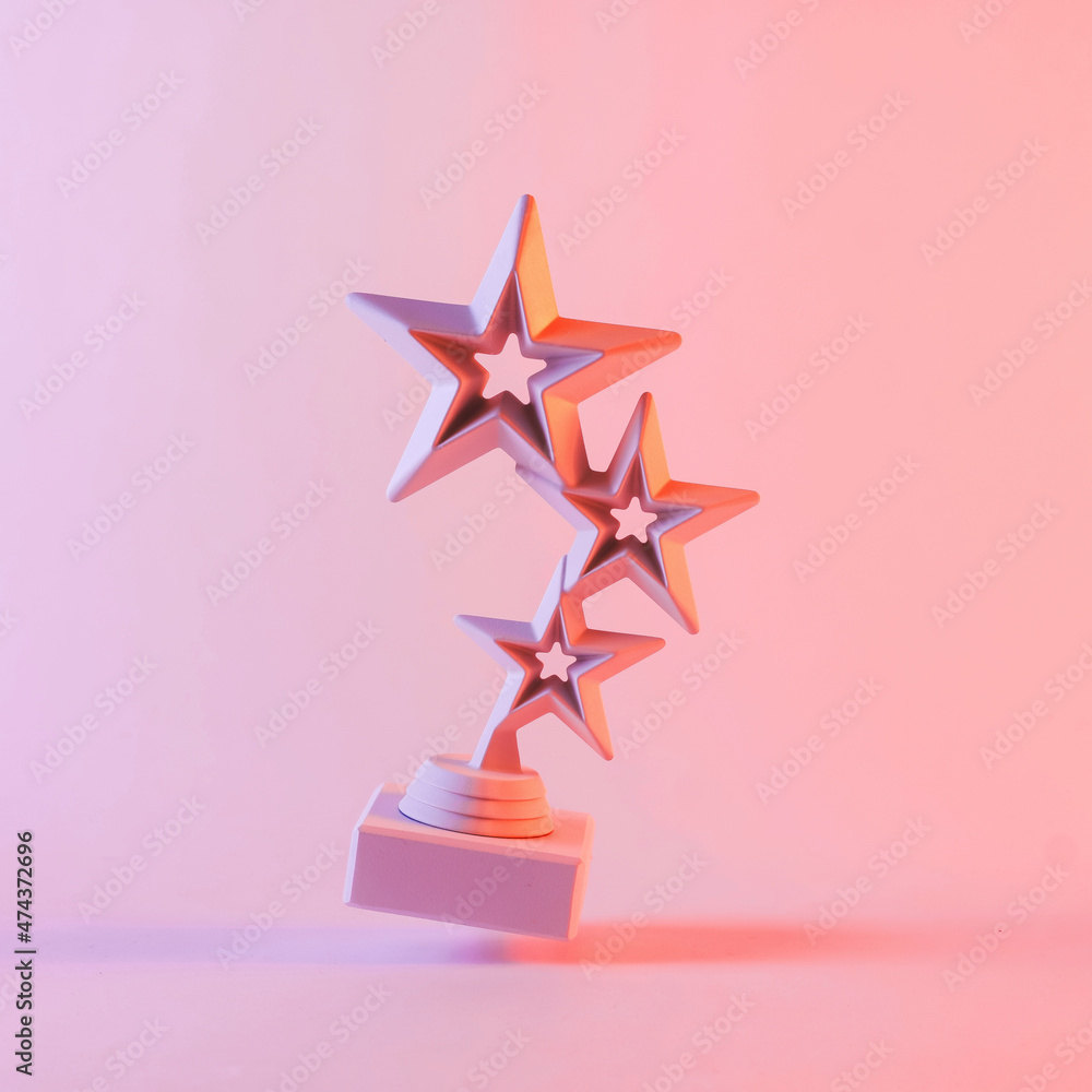 Award with three star shapes floating against pink background Stock ...