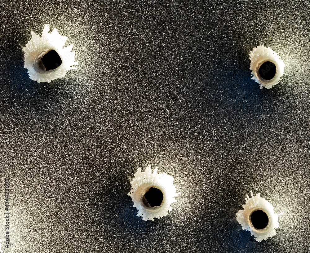 Bullet holes in metal. Concept, use of firearms. Stock Photo | Adobe Stock