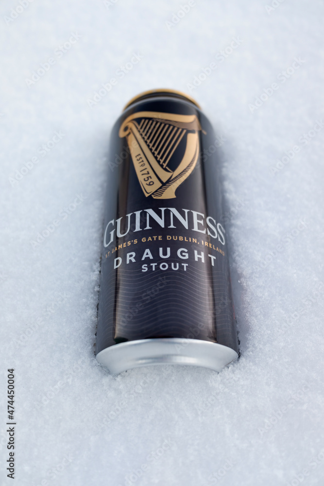 Can of Guinness draught Irish beer in snow, winter. Guinness is a ...