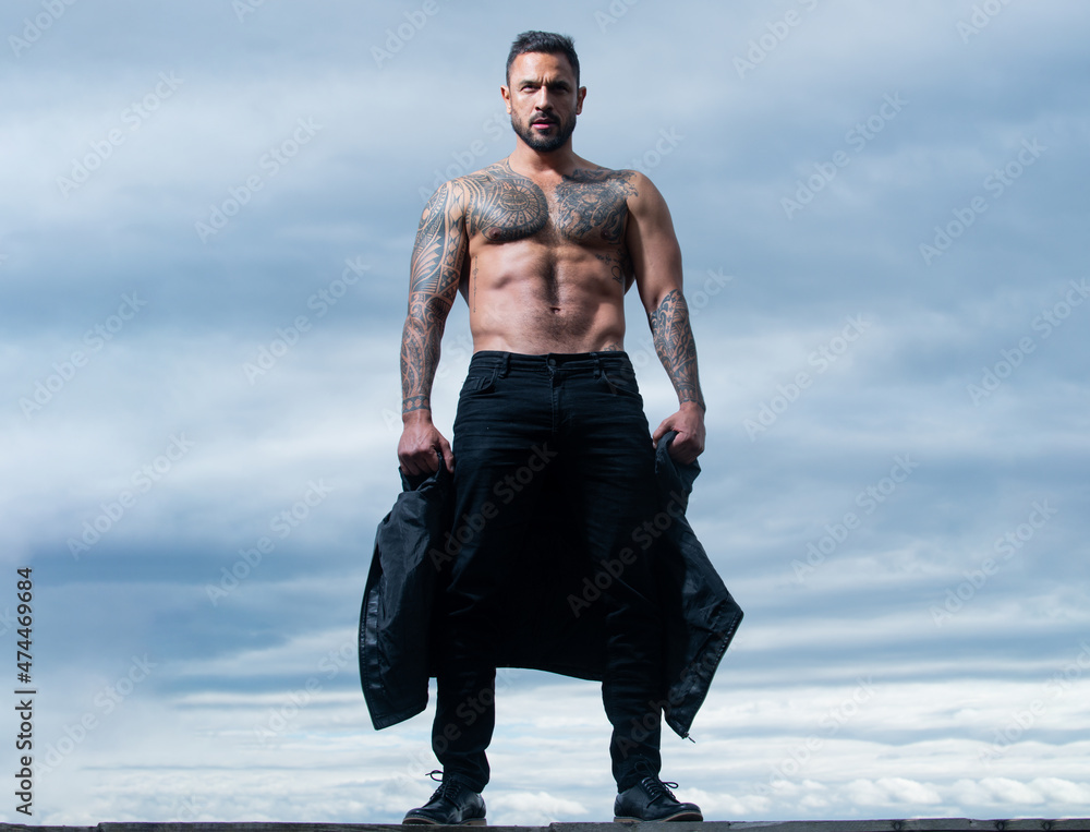 Confident attractive man with serious face. Strong muscular male body ...
