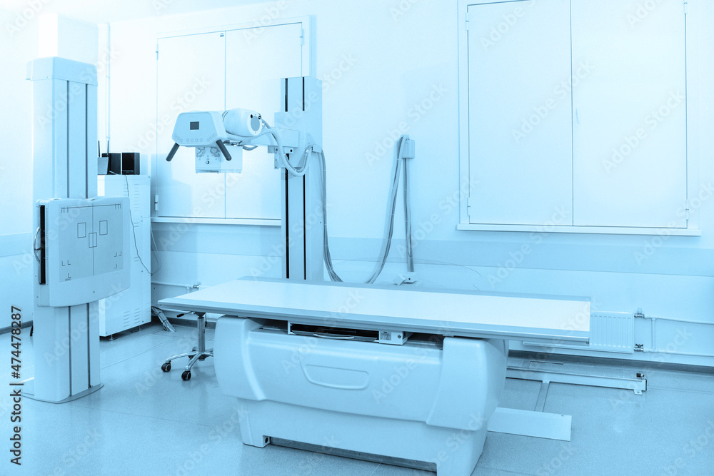 X-ray department in modern hospital. Radiology room with scan machine ...