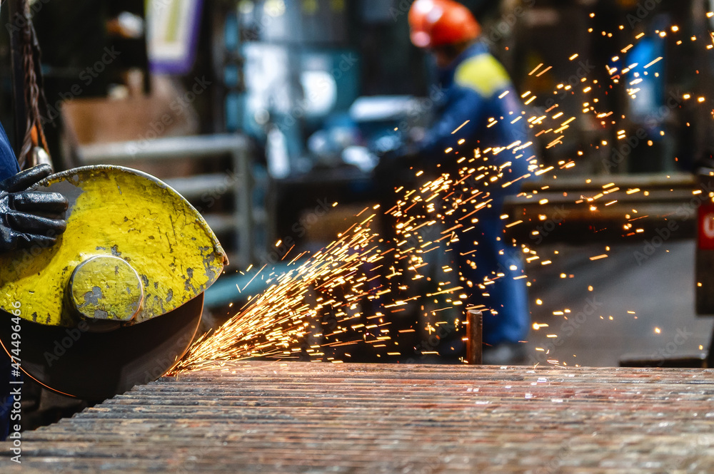 Cutting rolled metal using a powerful abrasive wheel cutting machine ...