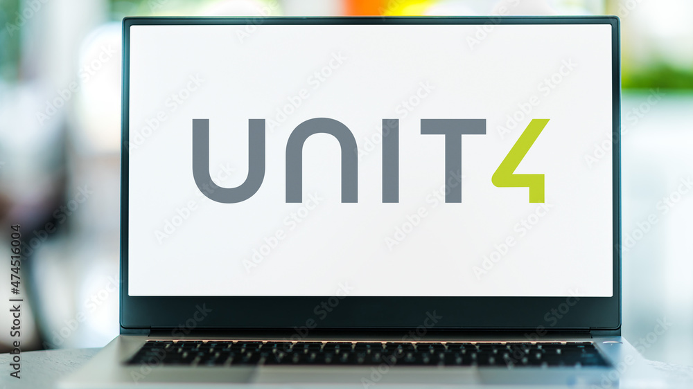 Laptop computer displaying logo of Unit4 Stock Photo | Adobe Stock