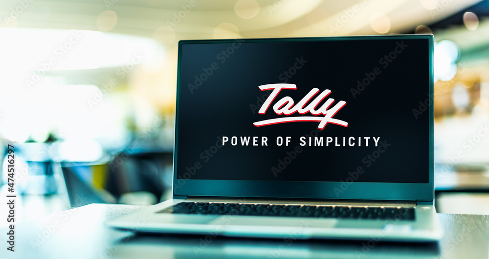 Laptop computer displaying logo of Tally Solutions Stock Photo | Adobe ...