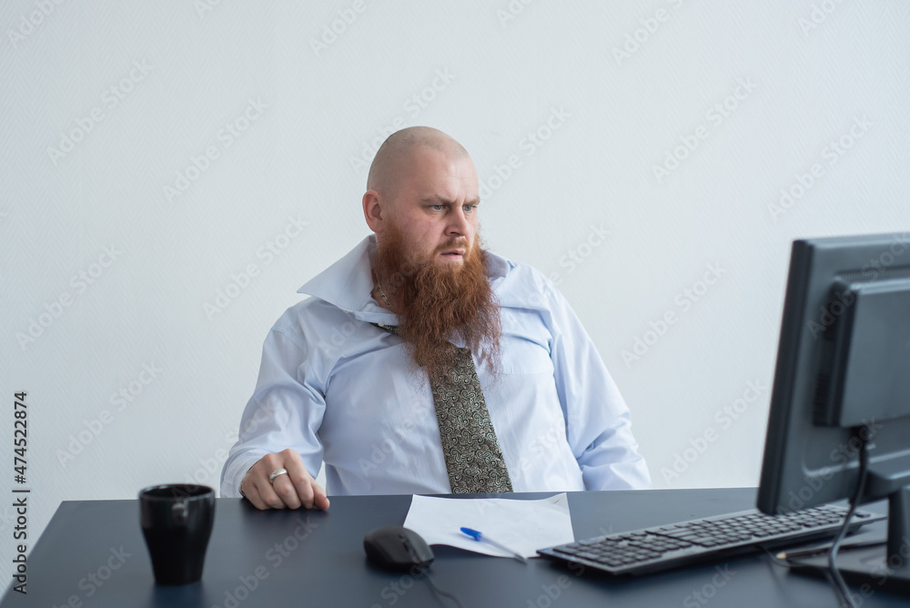 Problems for the office worker. A bald man in a white shirt sits at a ...