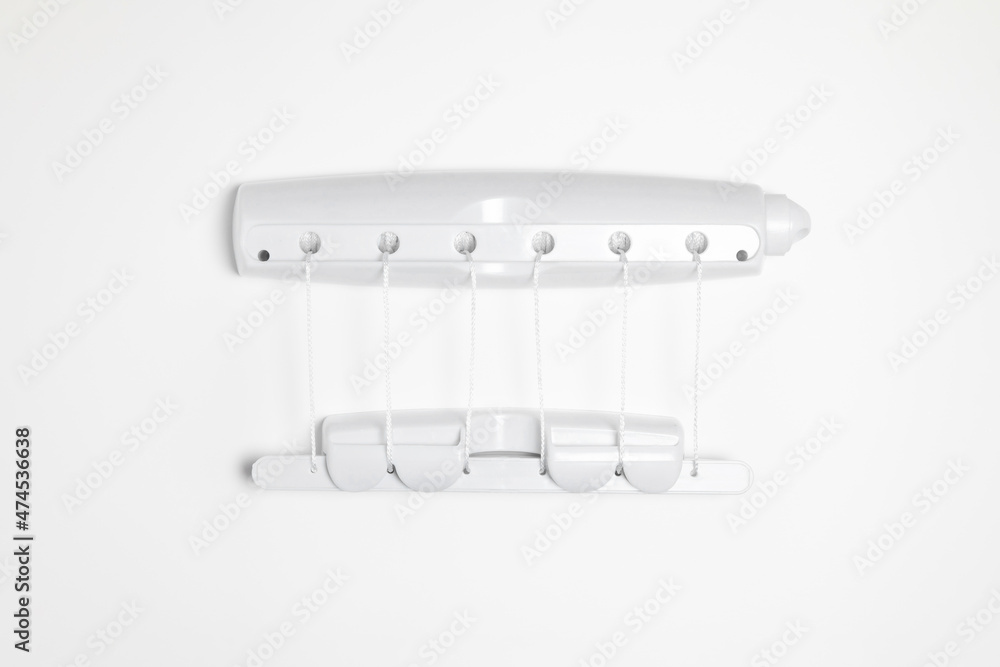 Clothes dryer with retracting wires isolated on white background.High ...