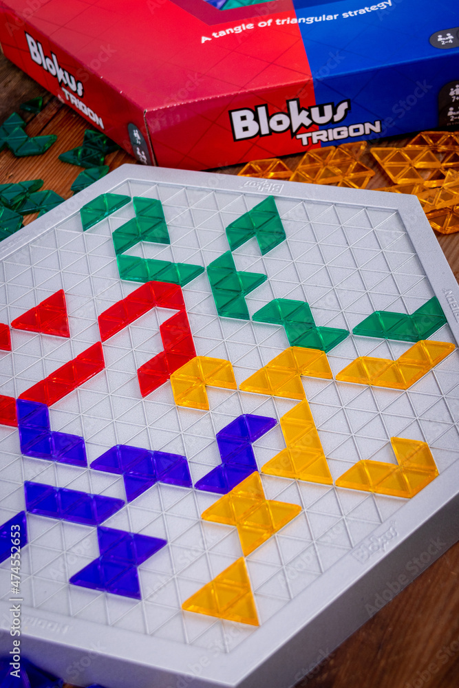 Blokus Trigon strategy board game on wood plank table Stock Photo ...