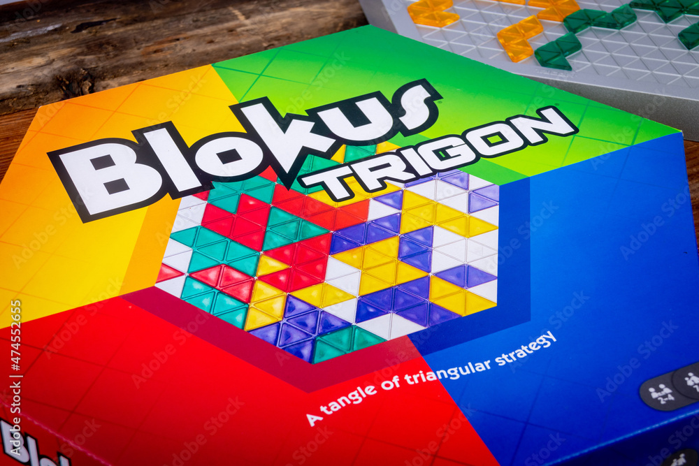 Blokus Trigon strategy board game on wood plank table Stock Photo ...