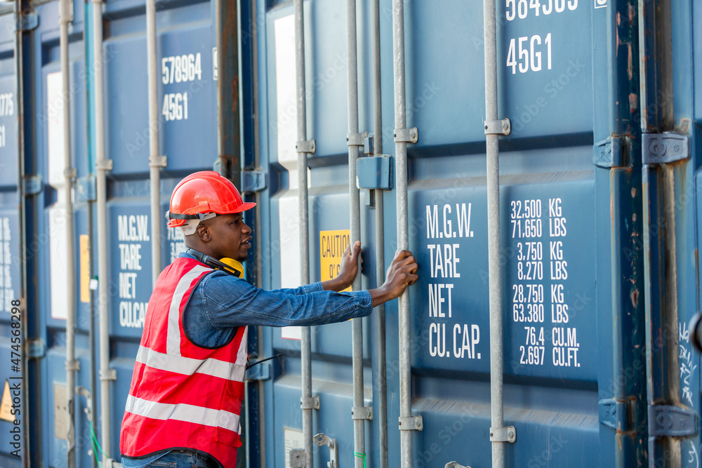 Professional foreman work at Container cargo site check up goods in ...