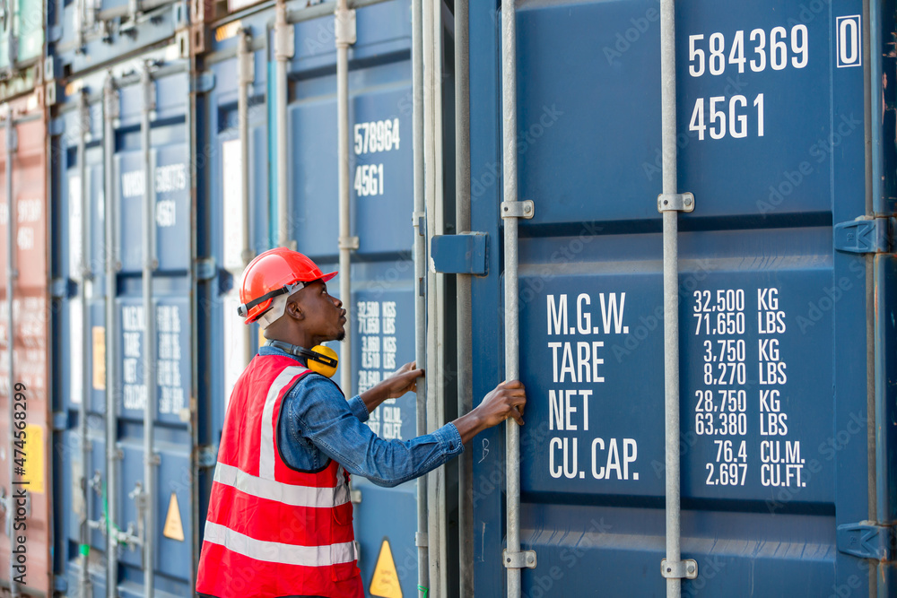 Professional foreman work at Container cargo site check up goods in ...