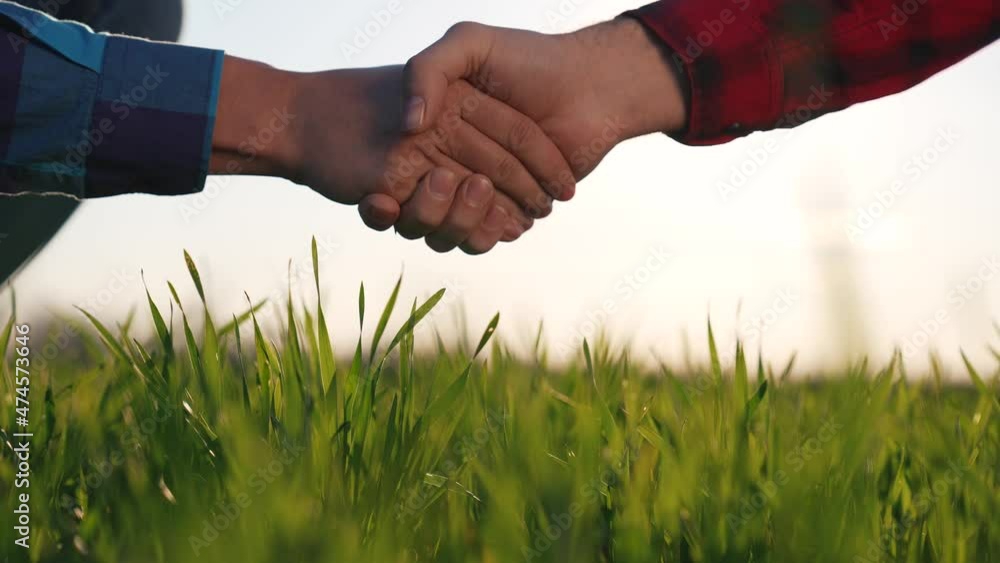 Agriculture. Farmers handshake in field. Agribusiness. Agricultural ...
