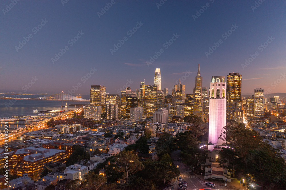 Nighttime aerial view of the San Francisco skyline with Coit Tower ...