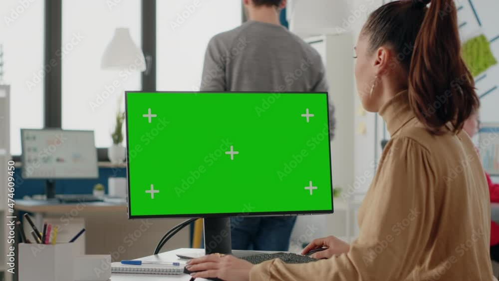 Adult using green screen on computer display in business office. Woman ...