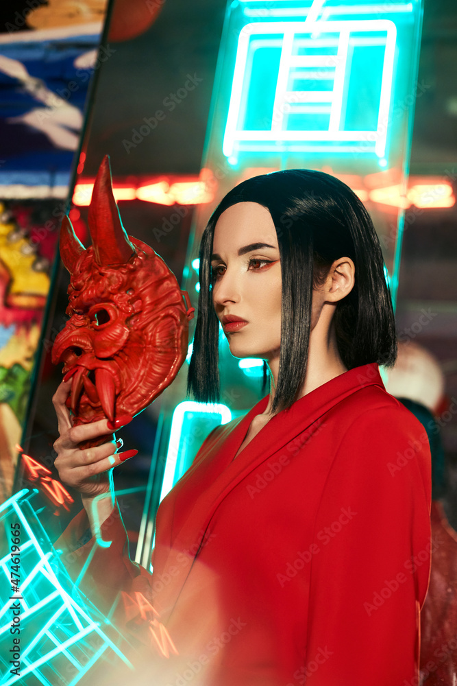Anime woman in a red suit with short hair cut, black hair. A killer ...