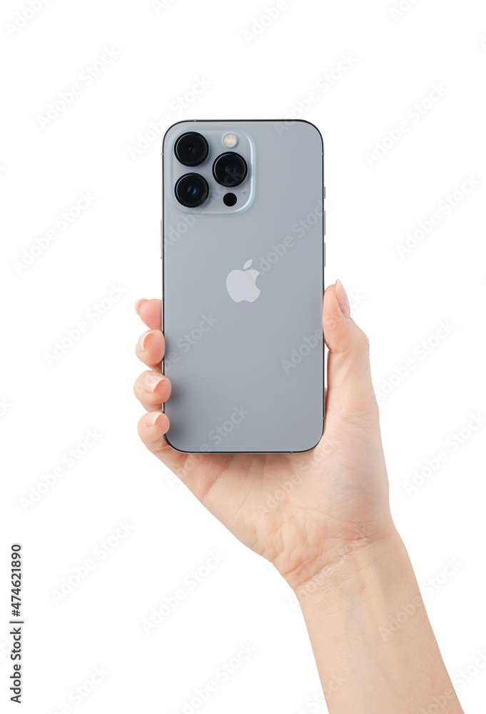 Apple iPhone 13 back side in a female hand isolated Stock Photo | Adobe ...