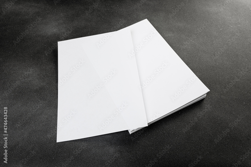 White business card sheet of paper a4 stack on a dark table. Clean ...