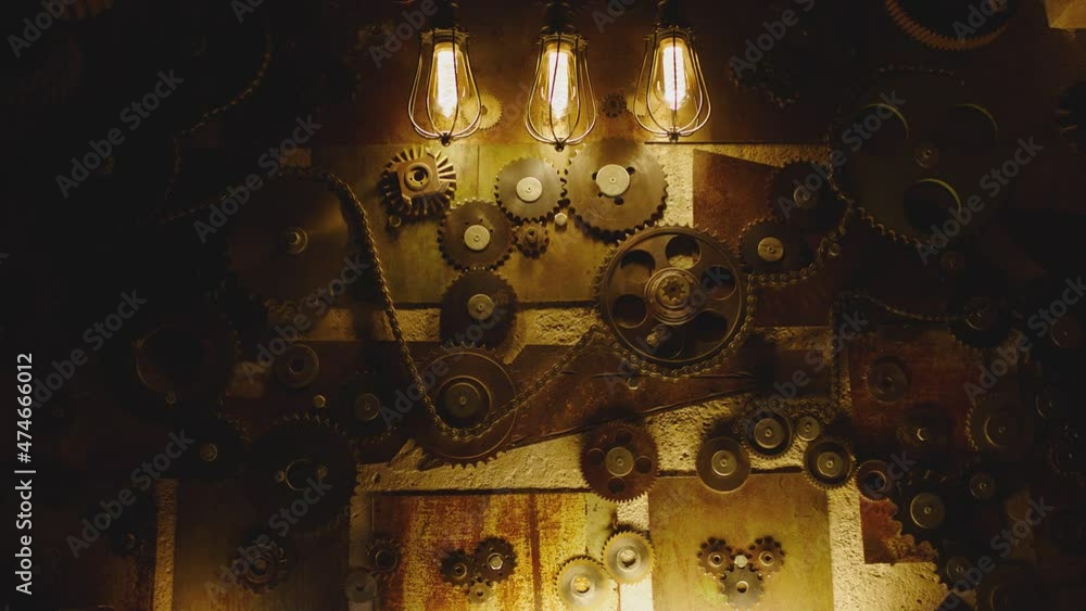 Camera moving on wall decorated with mechanism of metallic gears and ...