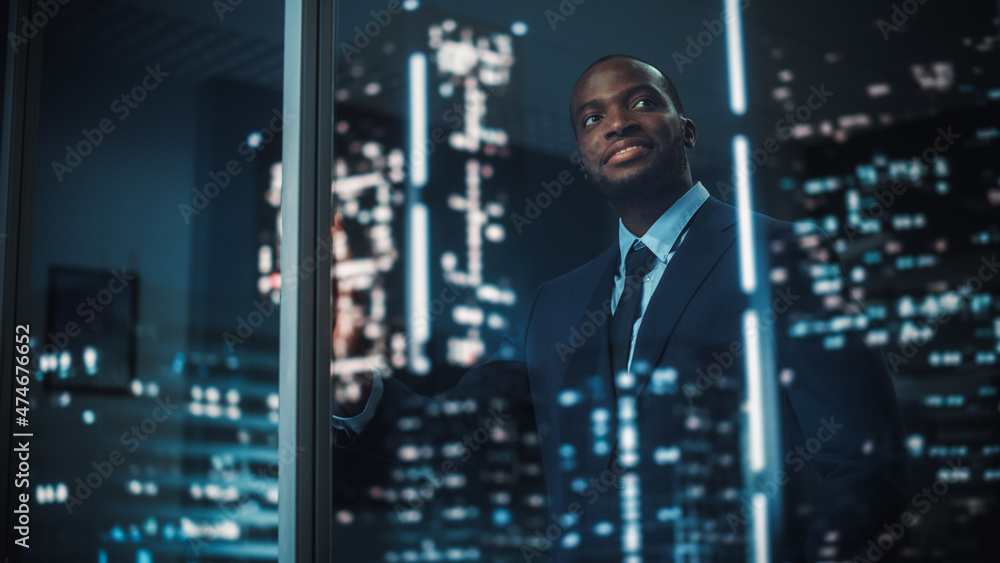 Zdjęcie Stock: Successful Black Businessman in a Tailored Suit Standing ...