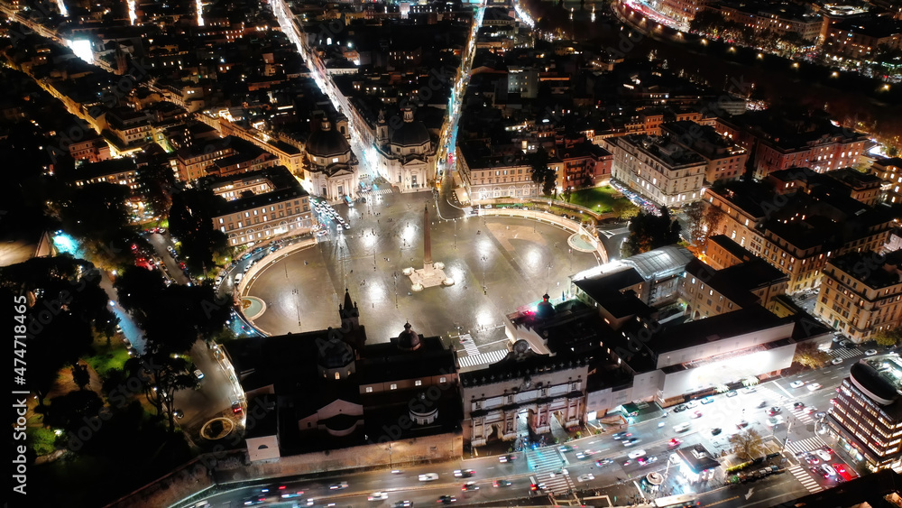 Aerial drone night shot from iconic illuminated Piazza del Popolo or People's square, an ...