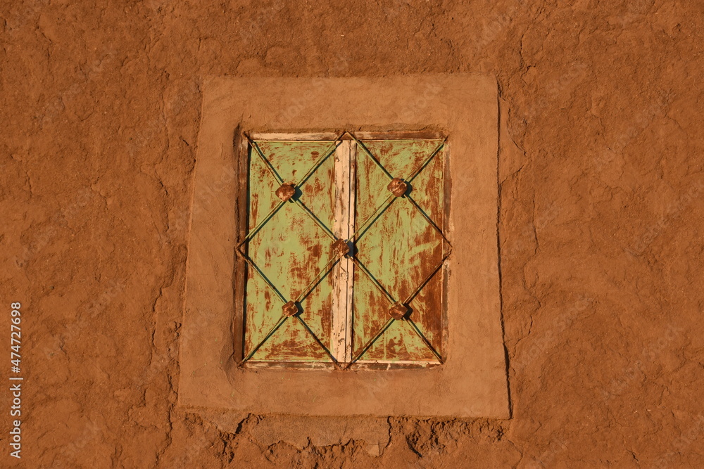 Colorful wooden window on a traditional nubian style mud house in Sudan ...