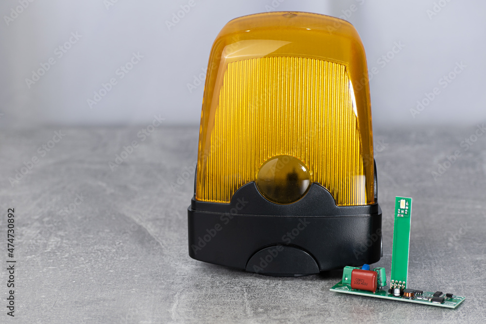 yellow warning light with spare parts, The construction site is ...