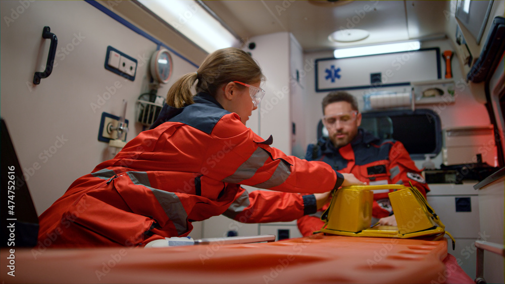 Team paramedics getting ready for patient resuscitation in emergency ...