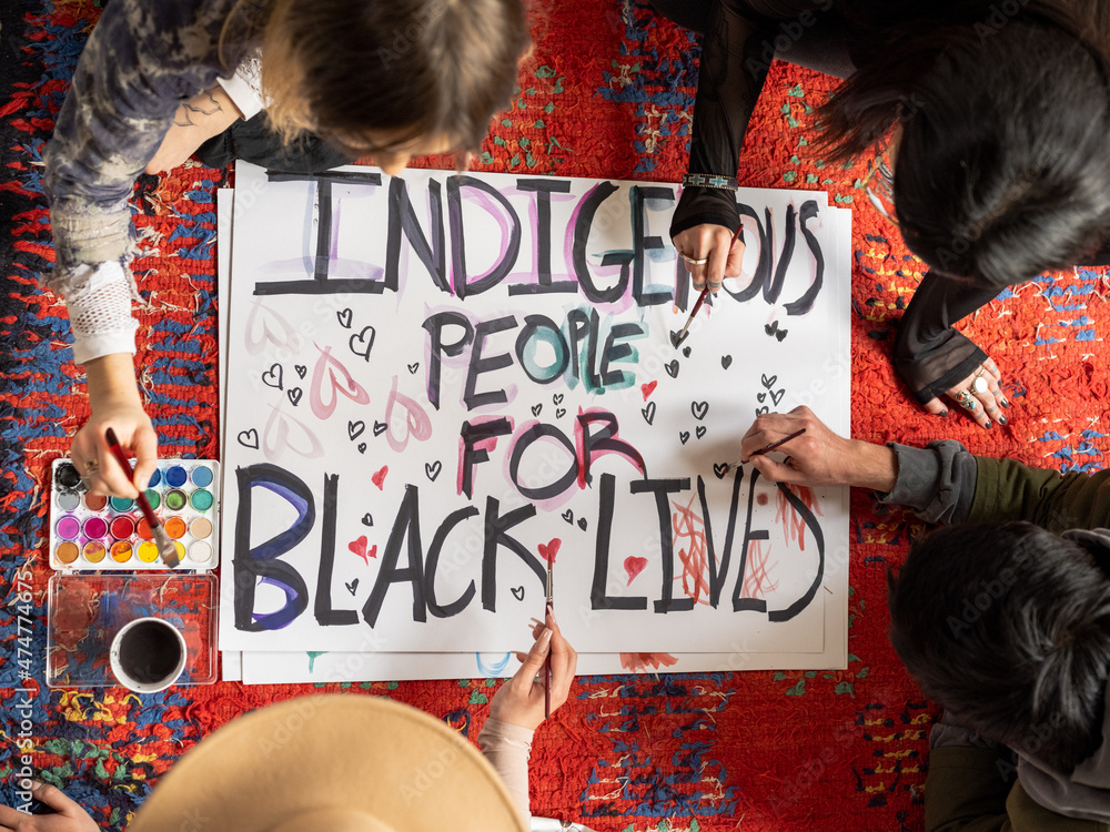 Young Indigenous friends making a selfie indoors Stock Photo | Adobe Stock