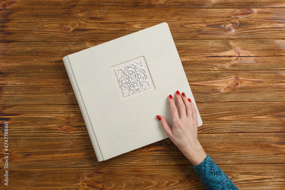 beige photo book with fabric cover. stylish wedding photo album. a ...