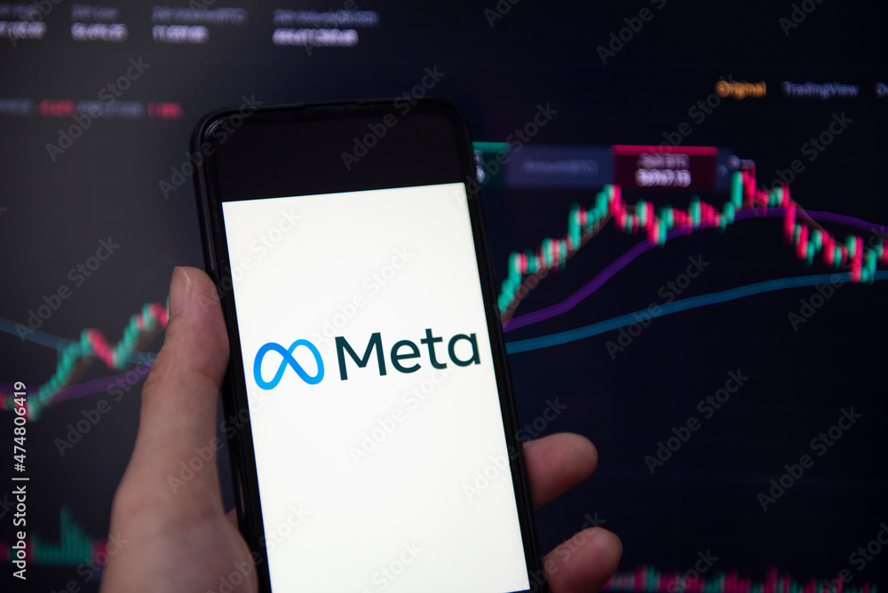 META logo on smartphone screen with hand hold and crypto currency or ...
