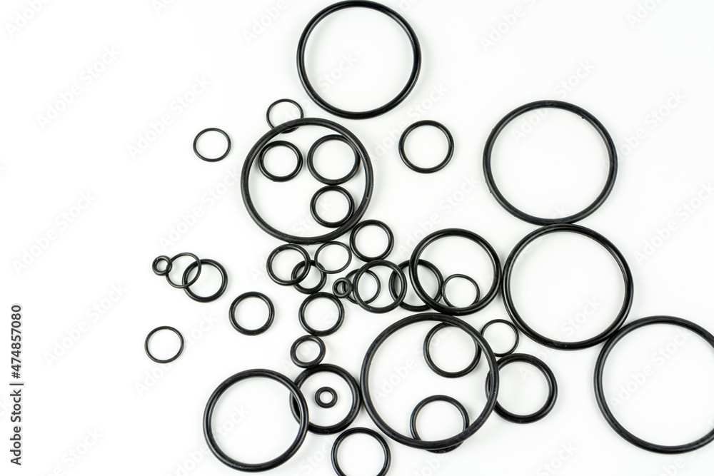 Black hydraulic and pneumatic o-rings in different sizes on a white ...