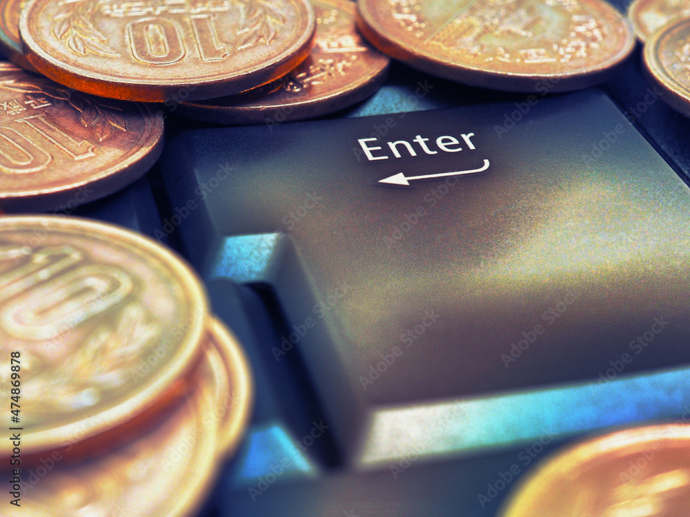 Japanese money coins and Enter button close up. Coins in 10 yen lie on ...