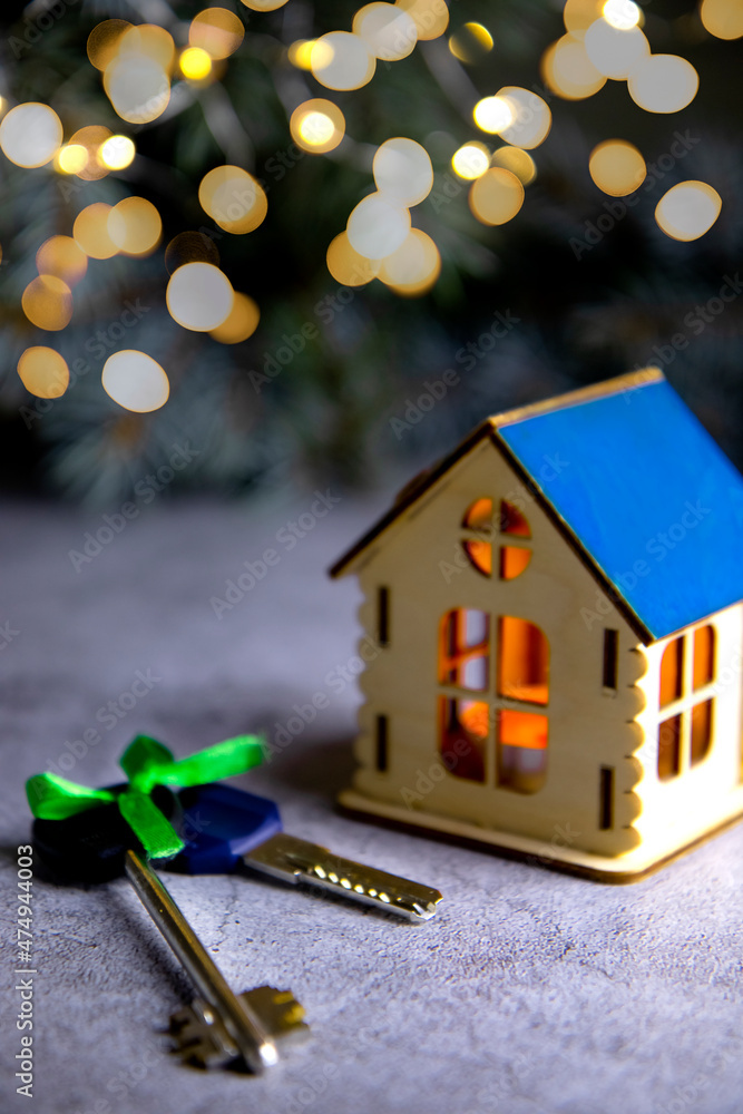 selective focus on a wooden house and keys. The concept of building a ...