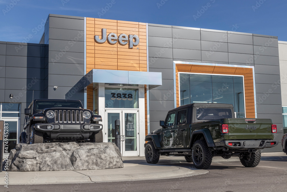 Jeep Wrangler and Gladiator display at a Stellantis dealership. The ...
