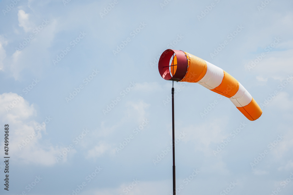 Wind direction and intensity indicator at an airport with wind. Stock ...