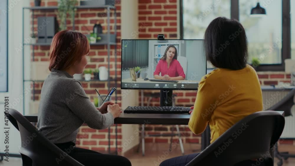 Asian team attending job interview on online video call in business ...